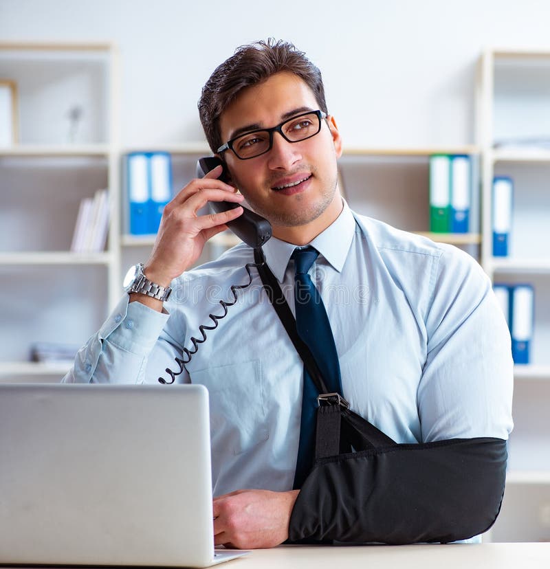 Businessman with Broken Arm Working in Office Stock Image - Image of ...