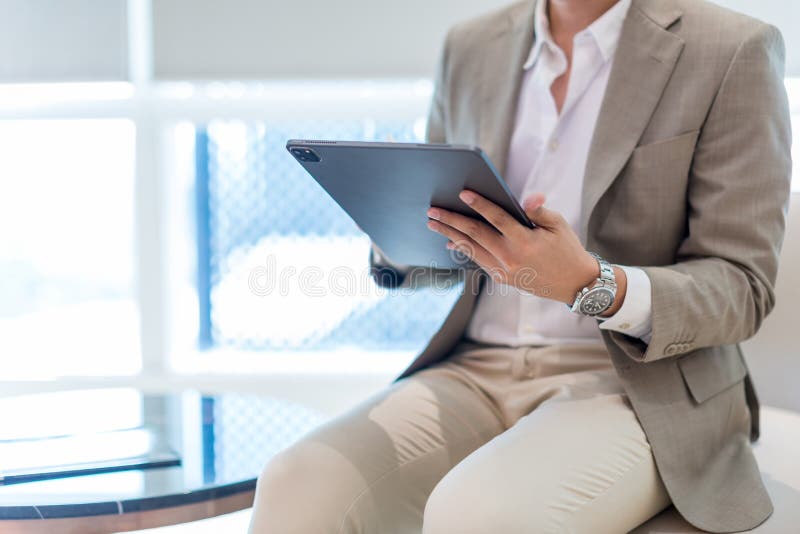 Businessman in Brown Suit Hand Holding Tablet for Writing and Thinking ...