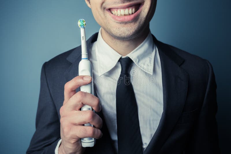 Businessman Brushing His Teeth Stock Image - Image of electric, formal ...