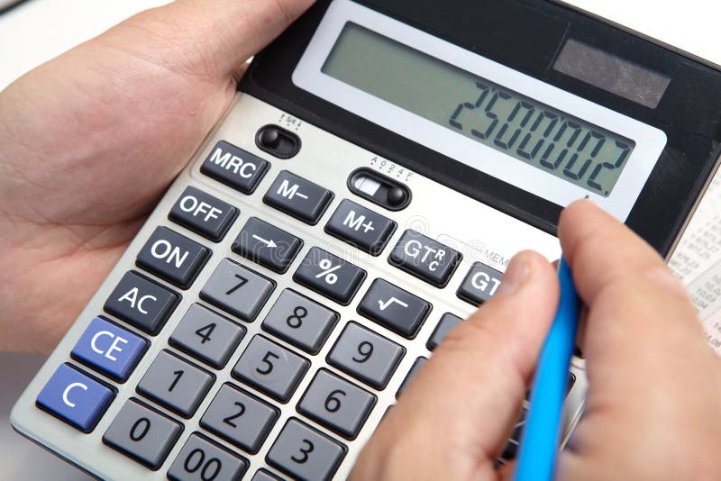 Businessman with Calculator in the Office Stock Photo - Image of paper ...