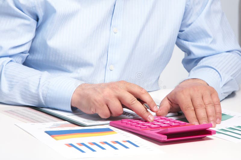 Businessman with Calculator in the Office Stock Photo - Image of ...