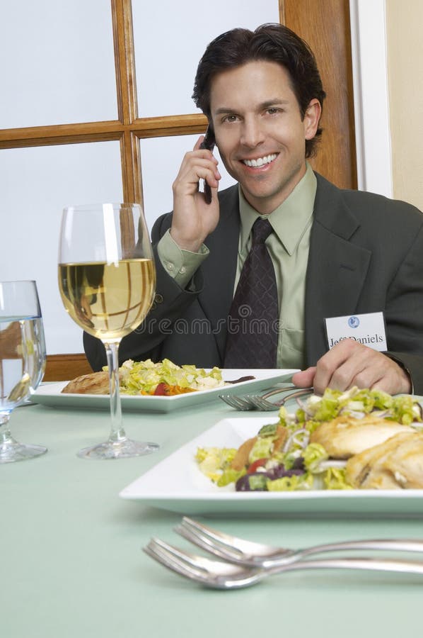 Businessman on a Call at Dining Table Stock Photo - Image of meal ...