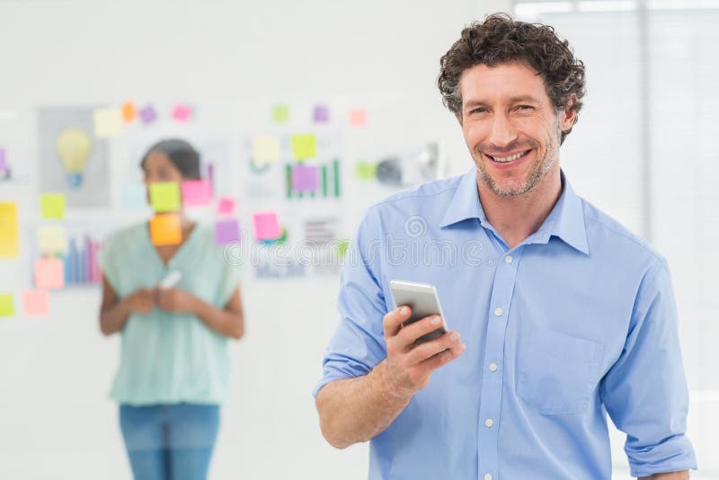 Businessman Calling while His Colleague Posing Stock Photo - Image of ...