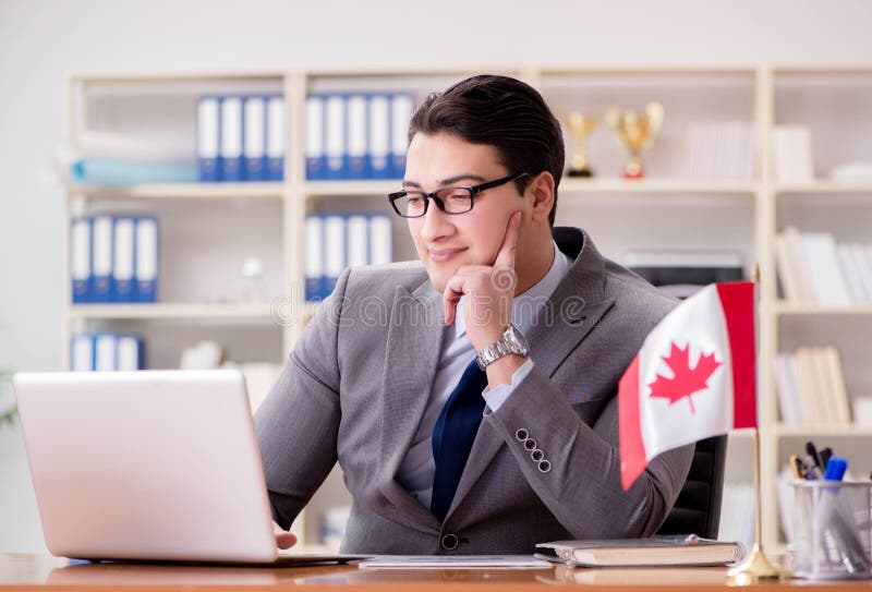 Businessman with Canadian Flag in Office Stock Image - Image of ...
