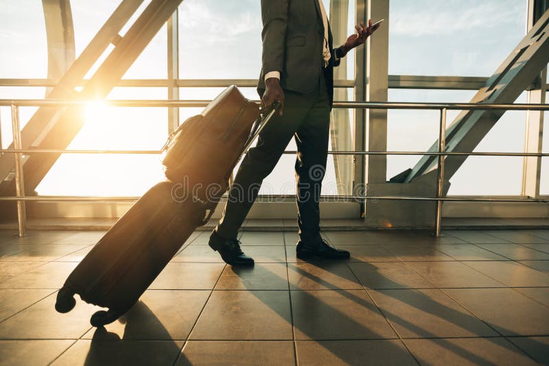 Businessman Carrying Suitcase, Walking through Passenger Boarding ... Businessman Carrying Suitcase, Walking through Passenger Boarding ...
