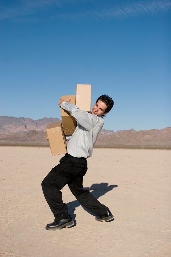 Businessman carrying boxes stock photo. Image of cardboard - 4814428