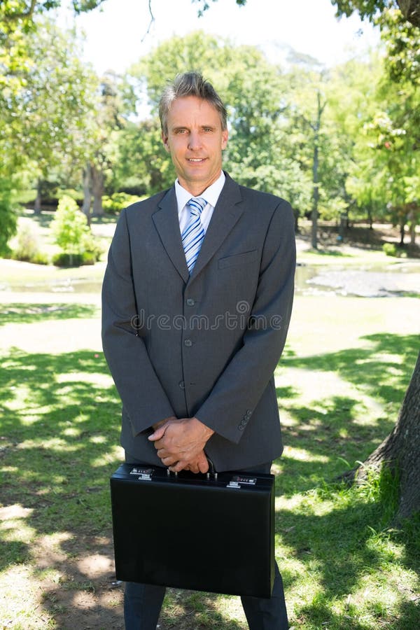 Businessman Carrying Briefcase Stock Image - Image of businessman ...