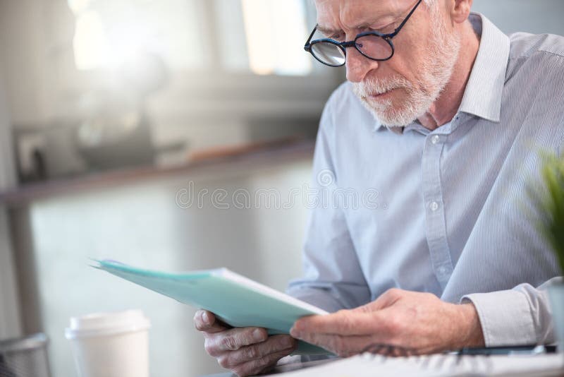 Businessman Checking a Document Stock Image - Image of male, office ...