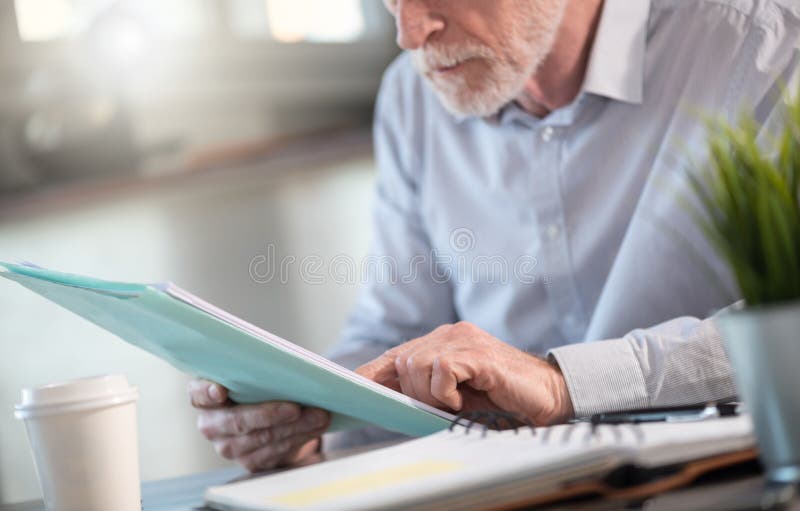 Businessman Checking a Document Stock Image - Image of terms, desk ...