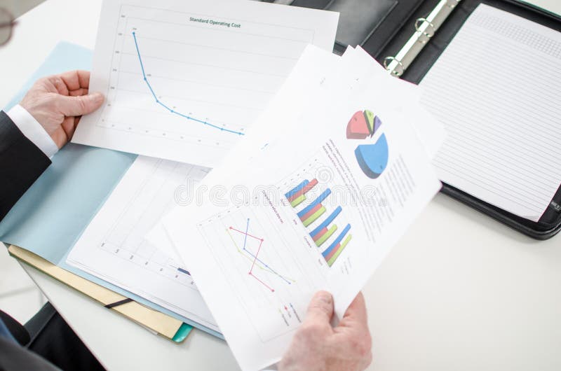 Graphs and File Folder with Label Financial Management. Stock Image ...