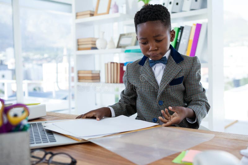 Businessman Checking File while Sitting at Desk Stock Image - Image of ...