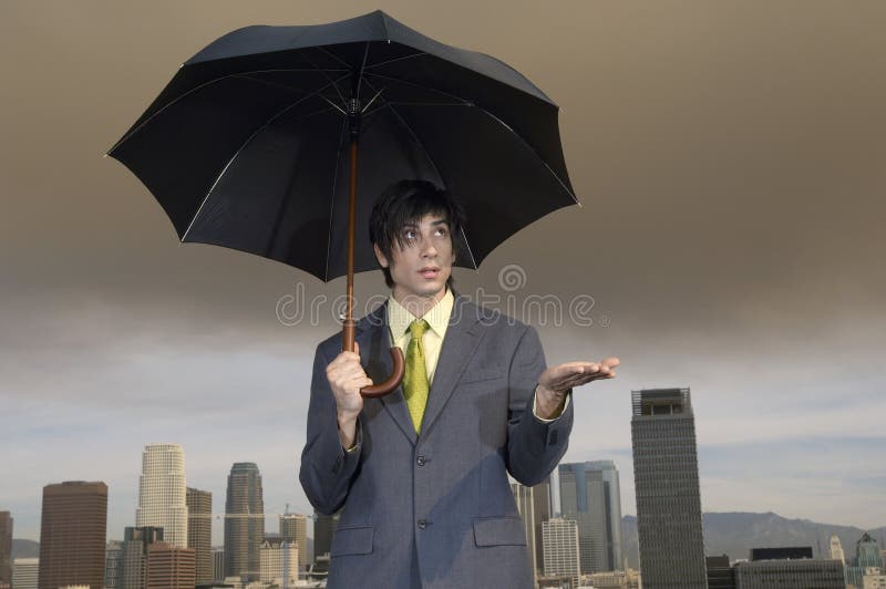 Businessman Checking If Its Raining Stock Image - Image of employee ...