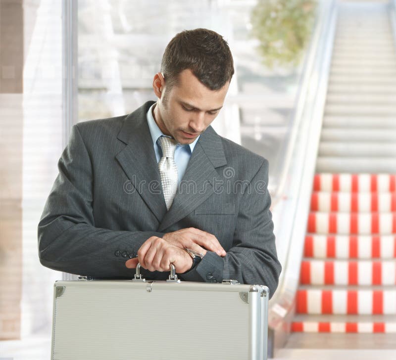 Businessman Checking Time at Office Stock Image - Image of businessman ...