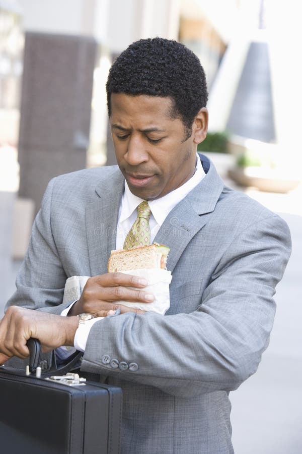 Businessman Checking Time stock photo. Image of sophisticated - 29654716