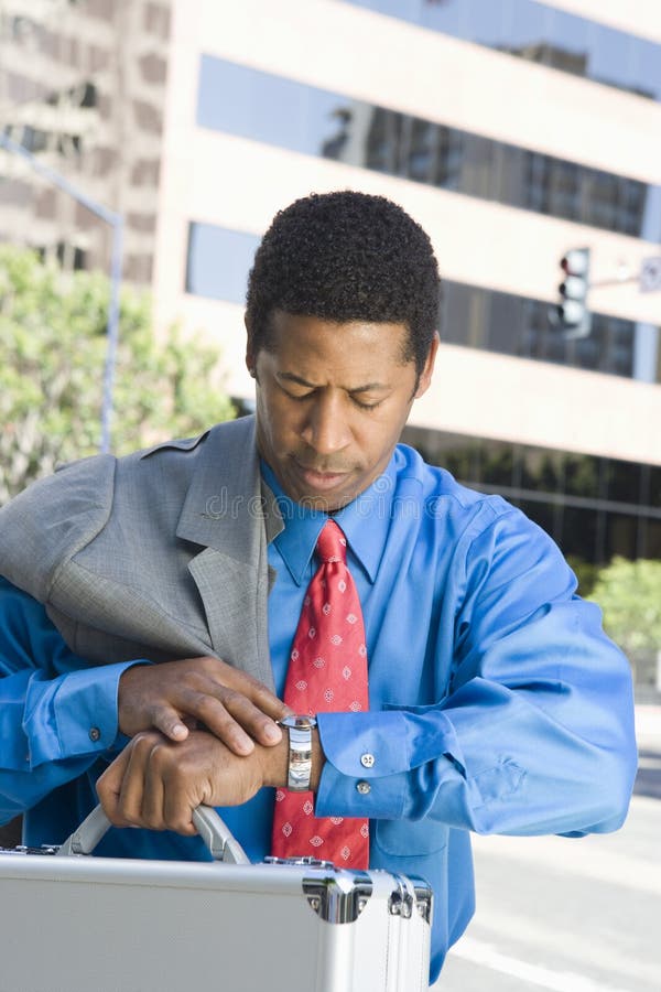 Businessman Checking Time stock image. Image of vertical - 29654739