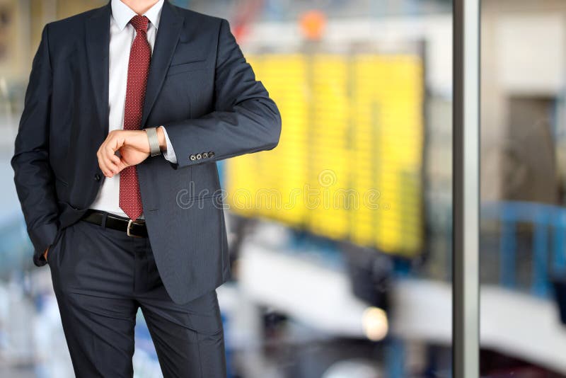 Businessman Checking Time on His Watch at the Airport Stock Photo ...