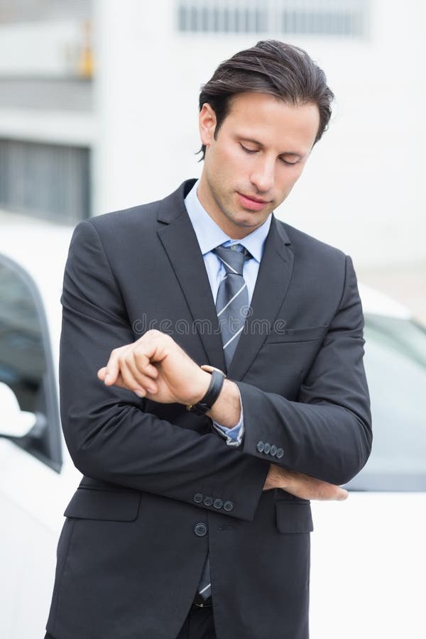 Businessman checking time stock photo. Image of vehicle - 50491568