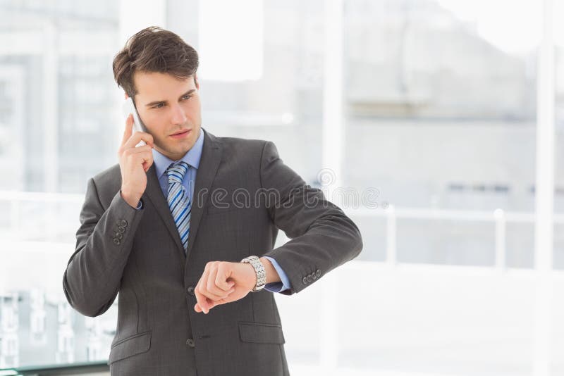 Businessman Checking the Time on the Phone Stock Image - Image of male ...