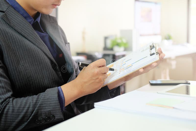 Businessman Checklist on Chart Board Paper Working on Table. Stock ...