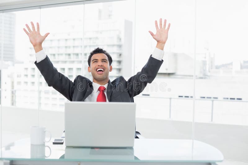 Businessman Cheering in Front of Laptop at Office Desk Stock Image ...