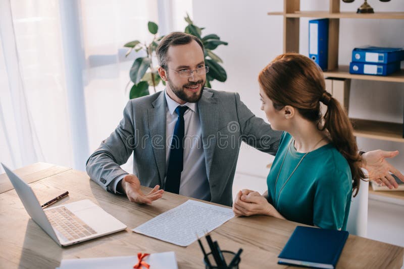 Businessman and Client Discussing Contract during Meeting Stock Photo ...