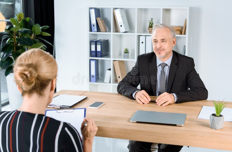 Businessman with Client at Office Stock Image - Image of indoor, adult ...