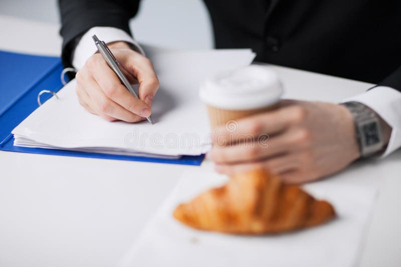 Businessman with Coffee Writing Something Stock Image - Image of pause ...