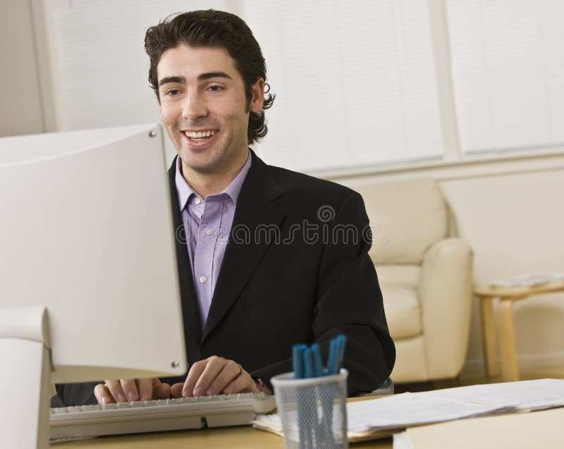 Businessman on Computer stock image. Image of twenties - 10679125