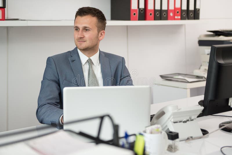 Businessman with Computer stock photo. Image of city - 56994140