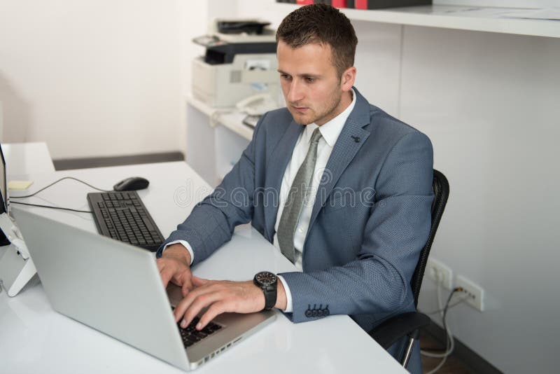 Serious Devoted Business Man Work in Office on Computer. Real Economist ...