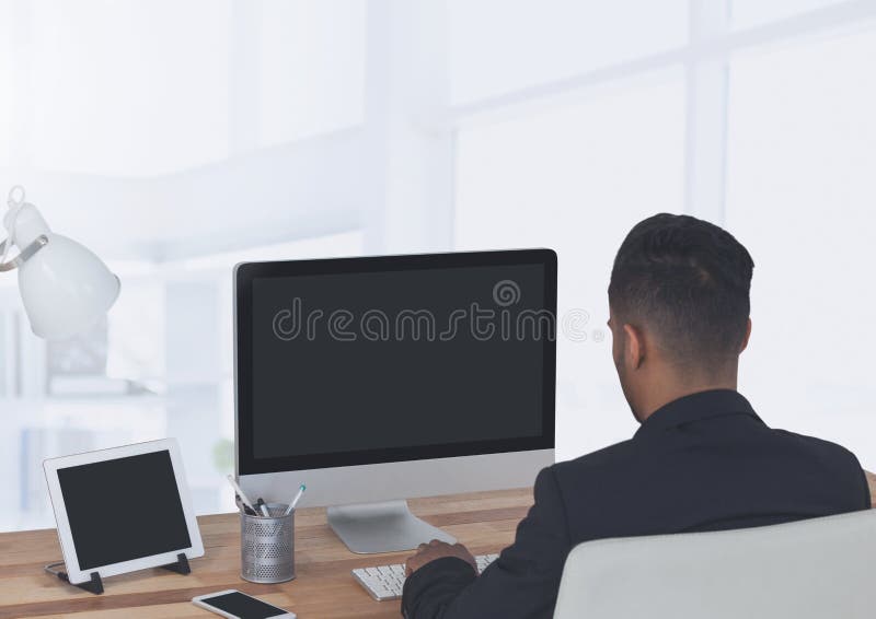 Businessman on Computer in Large Bright Office Stock Photo - Image of ...