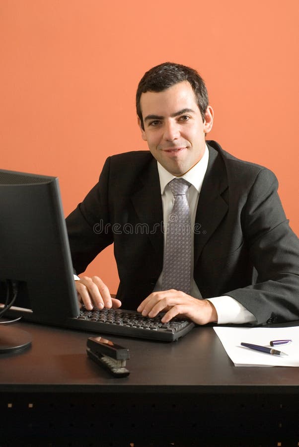 Young Businessman Leaning on Desk Stock Image - Image of monitor ...