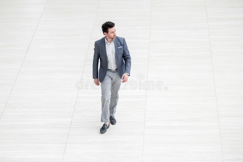 Businessman Confidently Steps Forward Stock Image - Image of attractive ...