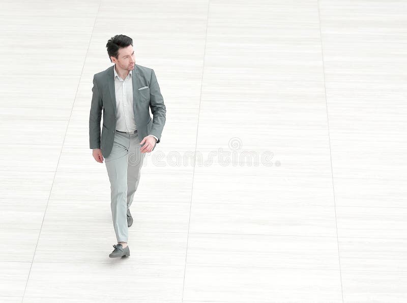 Businessman Confidently Steps Forward Stock Photo - Image of floor ...