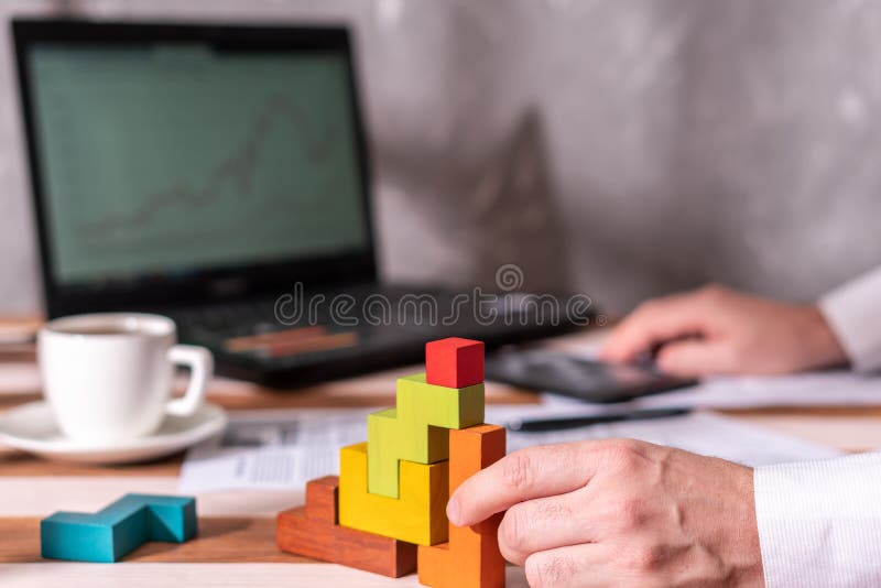 Businessman with Conundrum at Table in Office Stock Photo - Image of ...