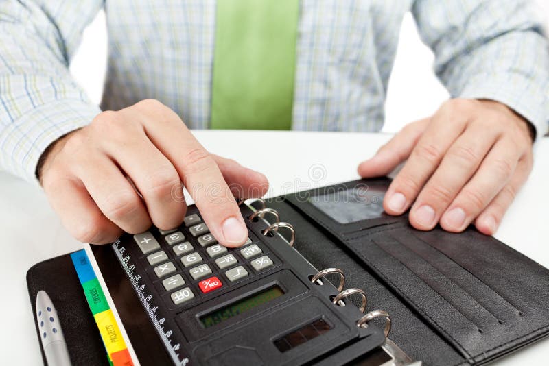 Businessman Counting on Calculator. Stock Image - Image of business ...