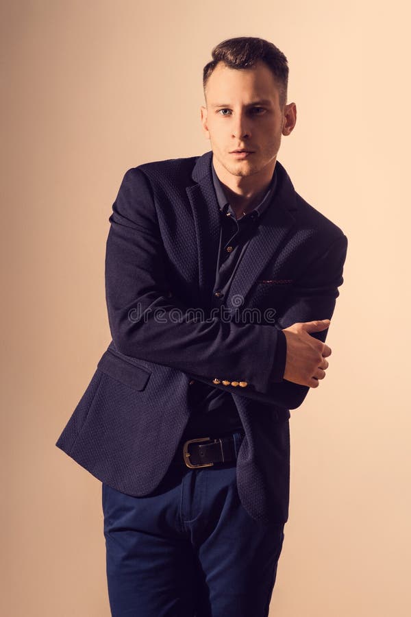 Businessman With Crossed Arms Pose Against Beige Background Stock Photo ...