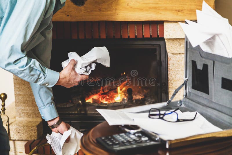 Businessman Destroying Important Documents from Case in Firepla Stock ...