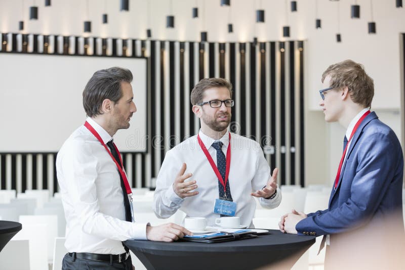 Businessman Discussing with Colleagues during Coffee Break in ...