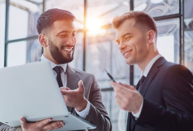 Two Professional Businessmen Discussing and Using Desktop Computer in ...