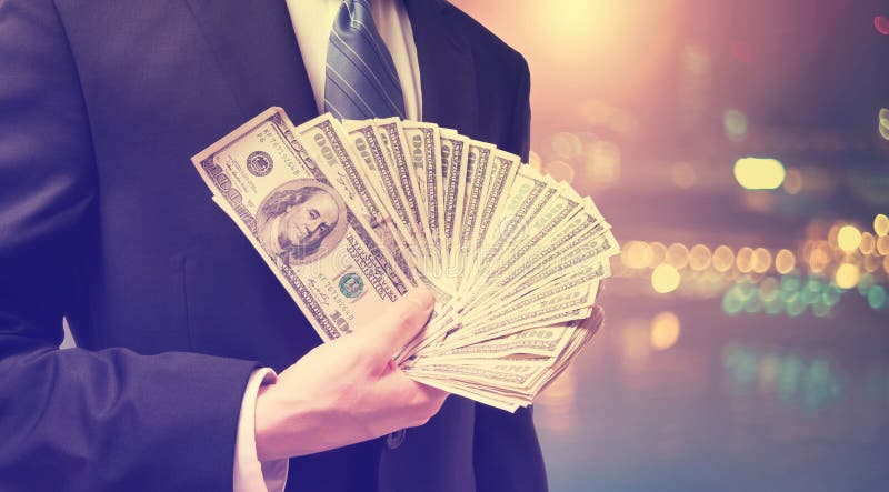 Man Displaying a Spread of Cash Stock Photo - Image of payment ...