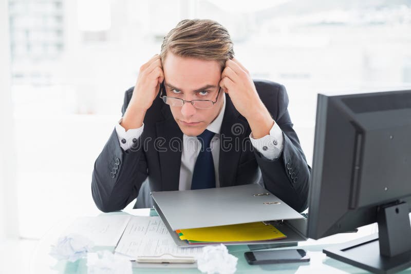 Businessman with Documents and Computer at Office Desk Stock Photo ...