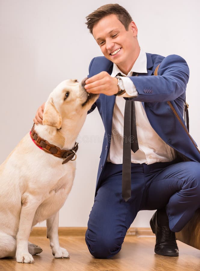 Businessman with dog stock photo. Image of expression - 58312166
