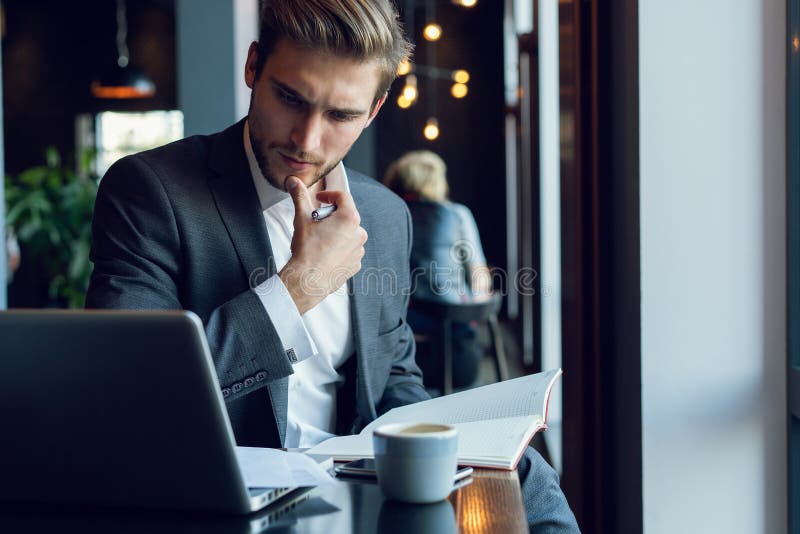 Businessman Doing His Work and Having Coffee in Cafe Stock Photo ...
