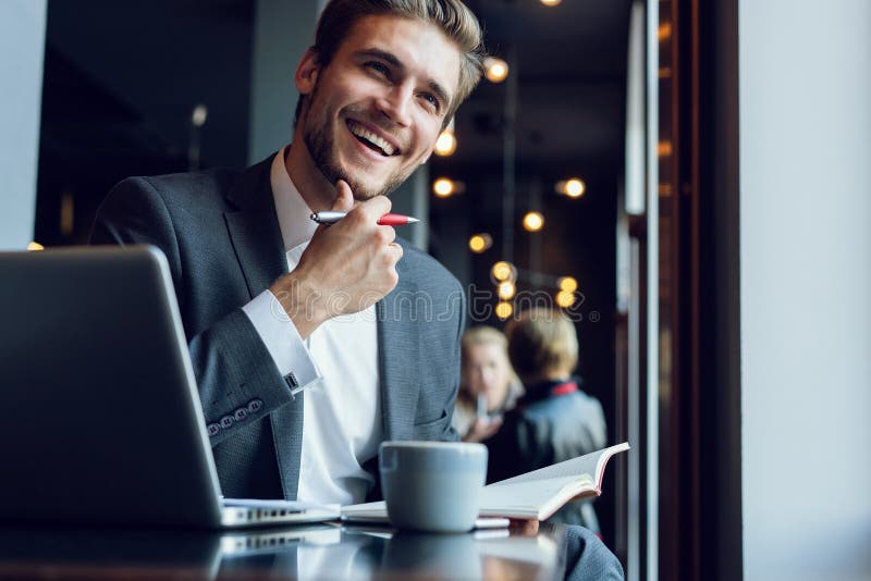 Businessman Doing His Work and Having Coffee in Cafe Stock Photo ...