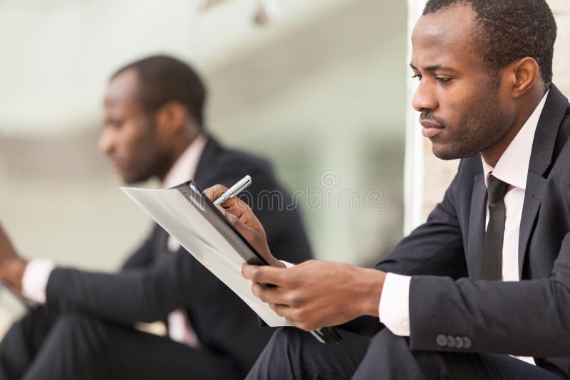 Businessman Doing Paper Work Stock Image - Image of contemplation ...