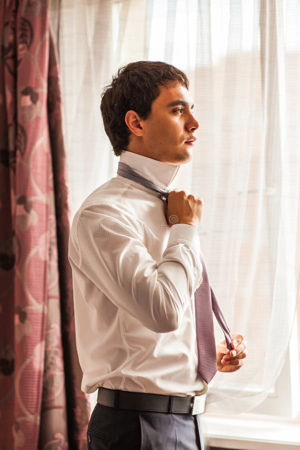 Businessman dressing up stock photo. Image of businessman - 64703326