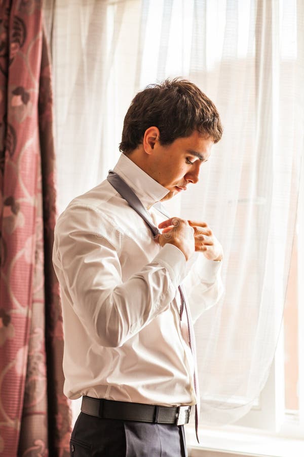 Businessman dressing up stock image. Image of clothing - 64703461