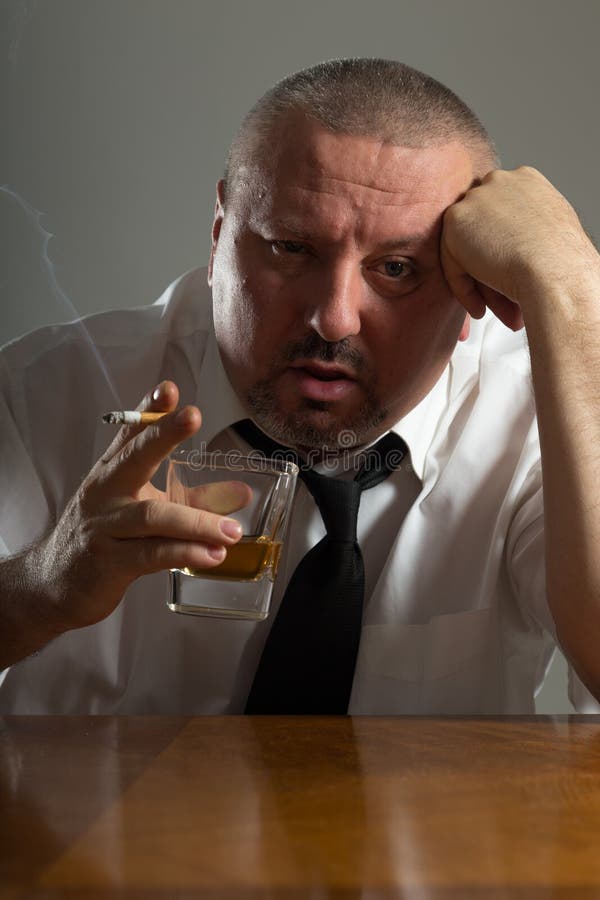 Businessman Drinking Alcohol and Smoking Cigarette Stock Image - Image ...