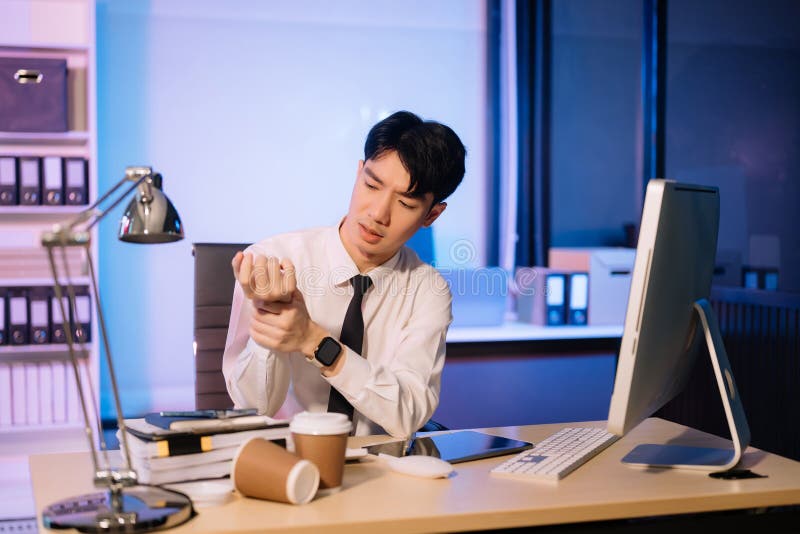 Businessman Drinking Coffee To Get Some Energy for Working Overtime ...